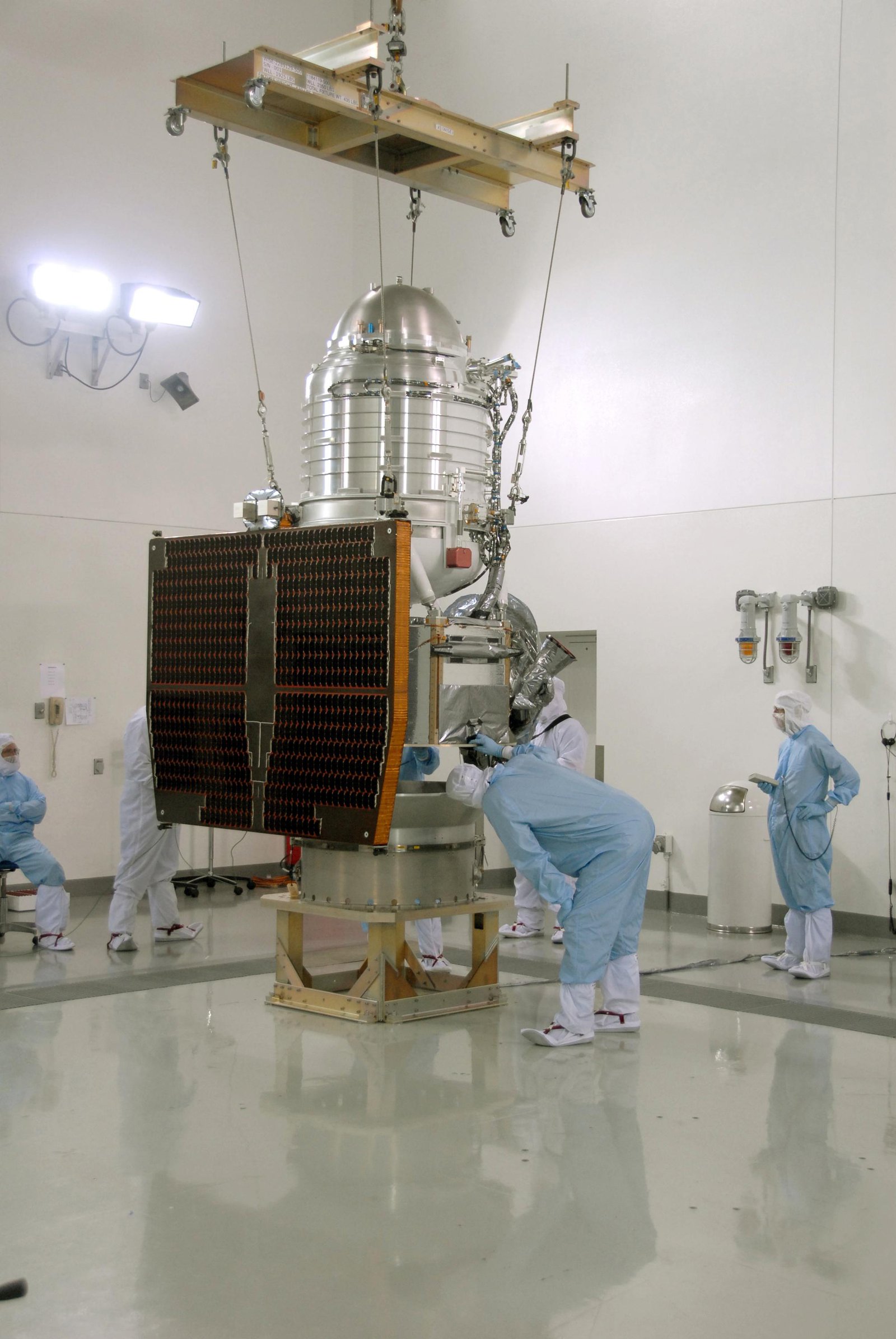 NASA's WISE Spacecraft Lifted from Work Stand