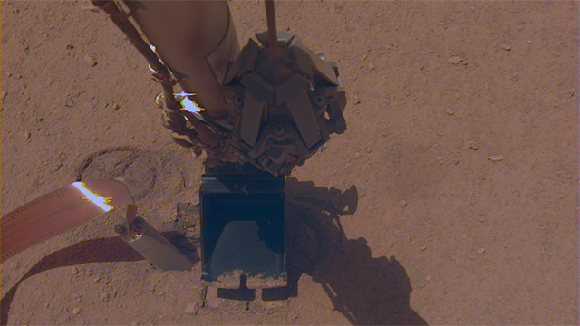 NASA InSight's Robotic Arm Helps Out its Mole on Mars